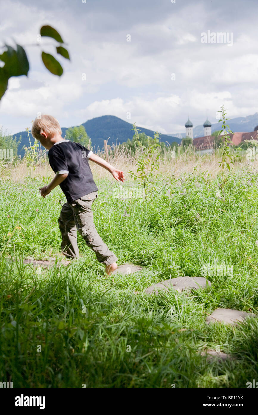 Side view blonde boy running hi-res stock photography and images - Alamy
