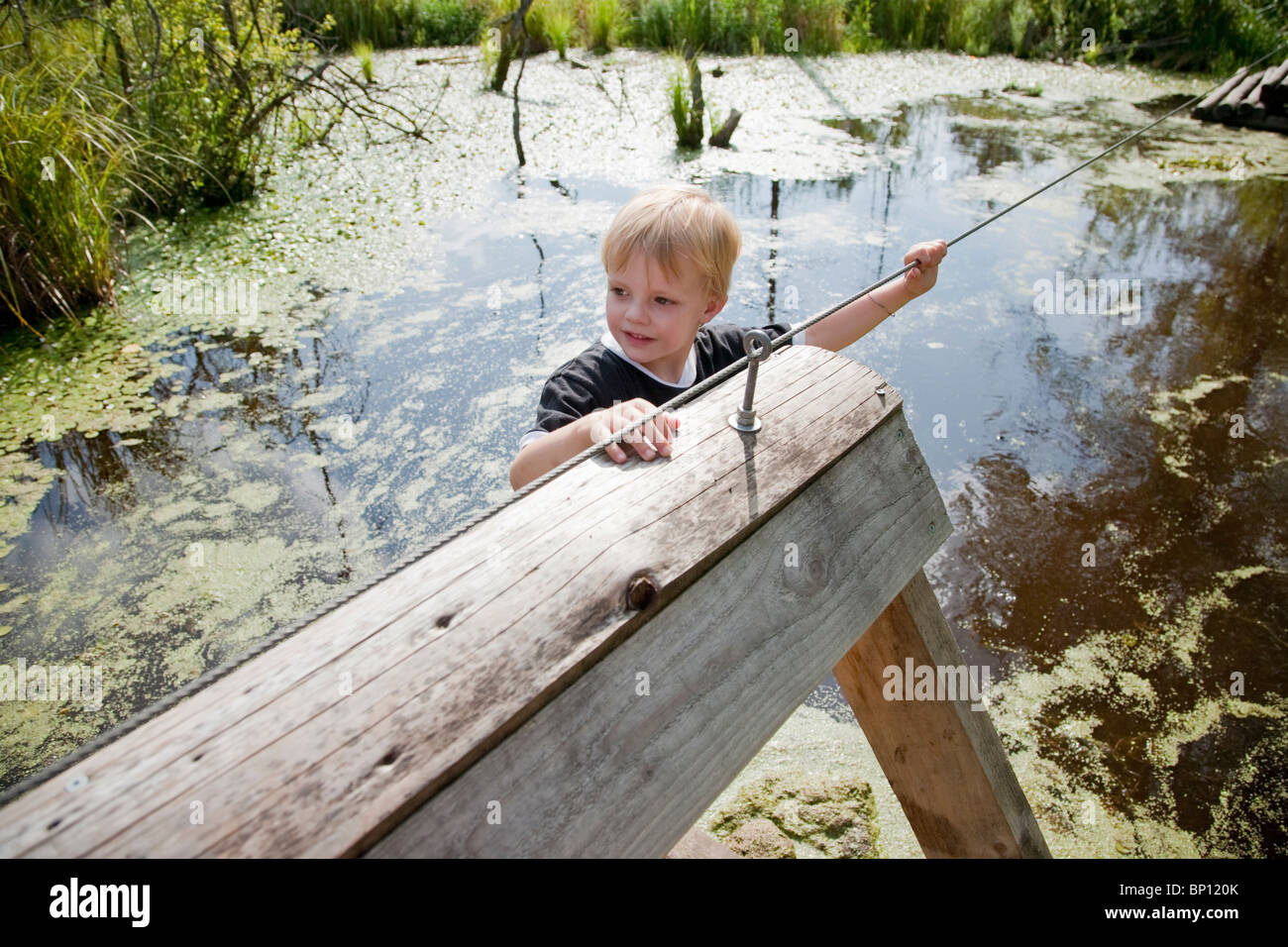 Boy on a float Stock Photo - Alamy