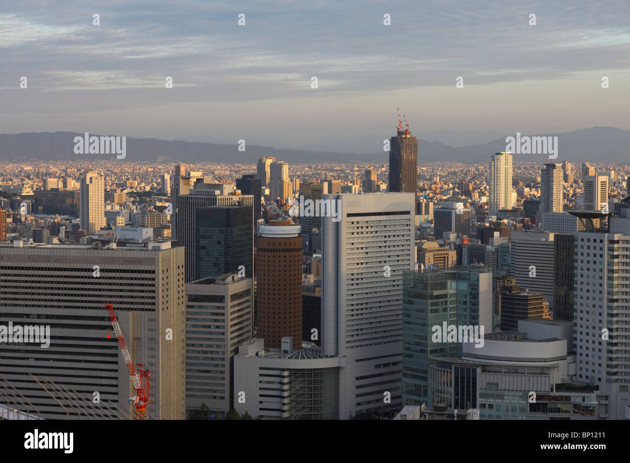 Osaka skyline at sunset Stock Photo - Alamy
