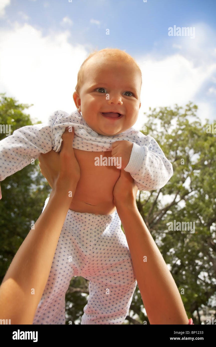 Up up and away with mom Stock Photo - Alamy