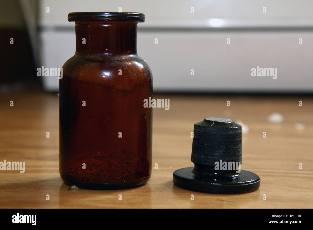 Open laboratory bottle Stock Photo - Alamy