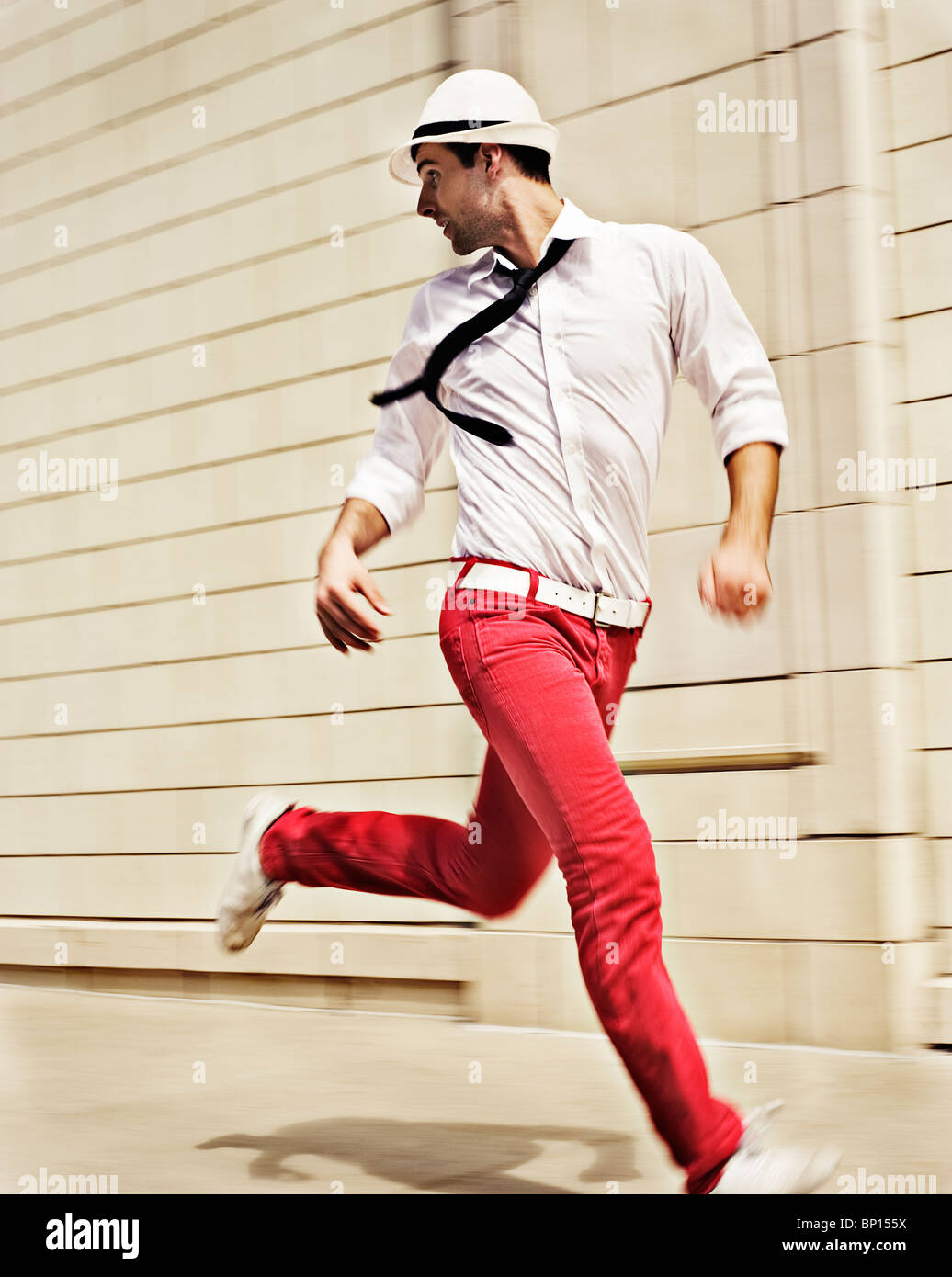 Man in tie running Stock Photo - Alamy