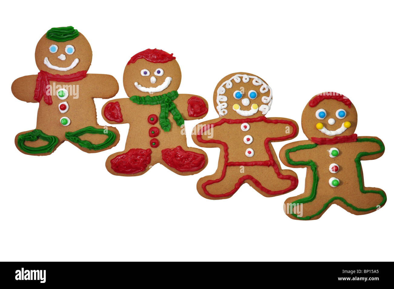 Four decorated gingerbread cookies isolated on white background with ...