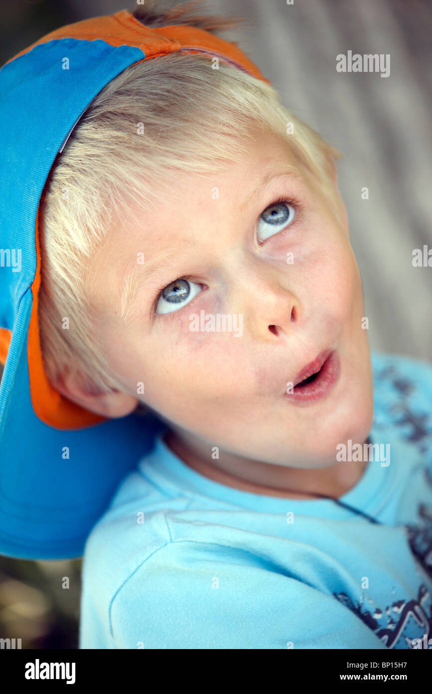 Portrait of little boy making a face Stock Photo - Alamy