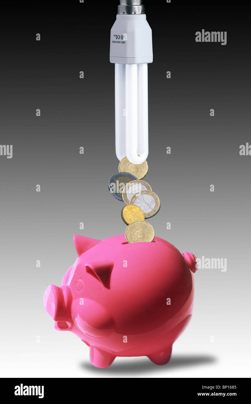 Euro coins falling from Energy saving Lightbulb in a piggy bank Stock ...