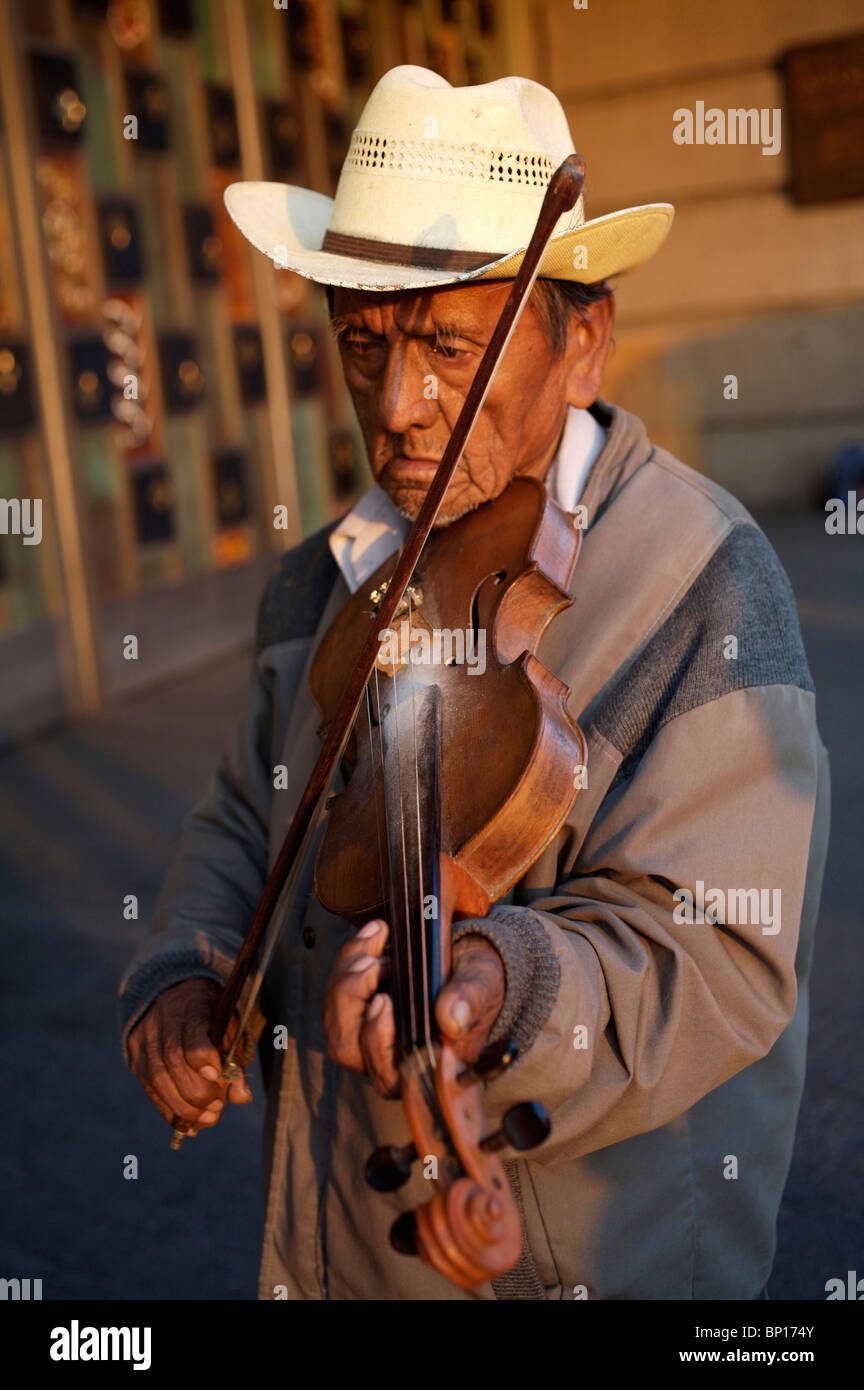 A man plays a violin at the Our Lady of Guadalupe Basilica in Mexico ...