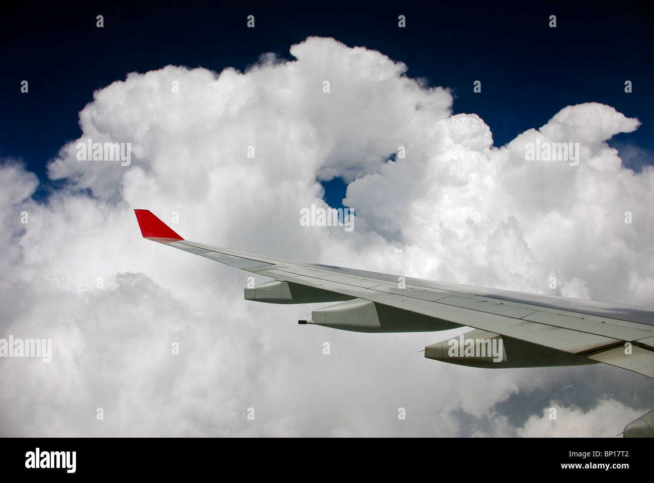 Plane wing in clouds Stock Photo - Alamy