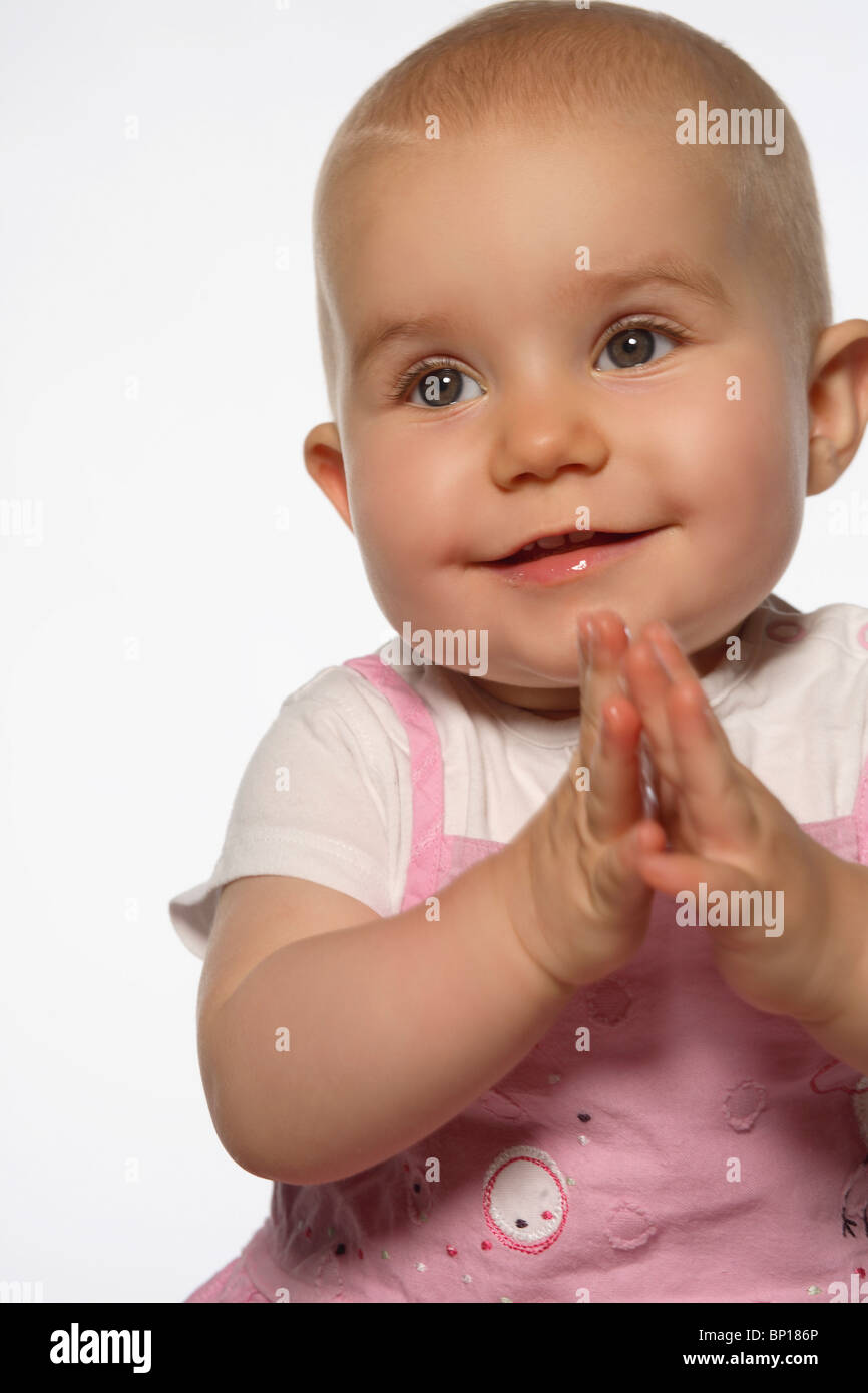Baby girl clapping hands Stock Photo - Alamy
