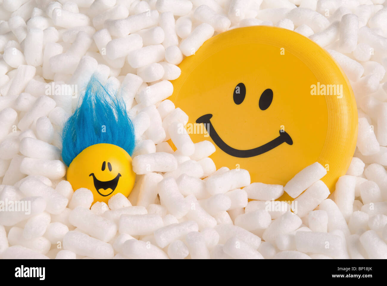Happy Faces In Styrofoam Packing Peanuts Stock Photo - Alamy