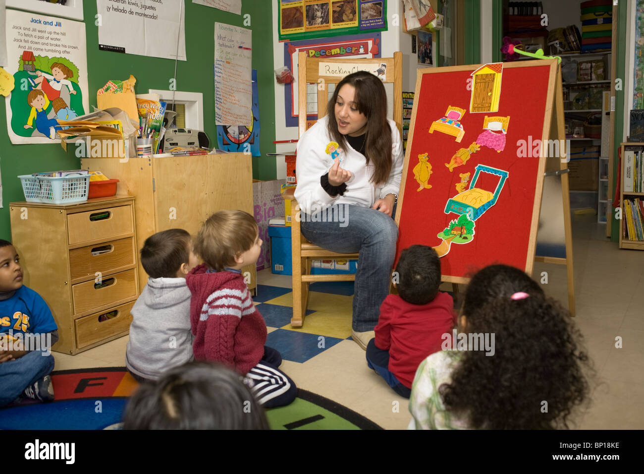 Preschool teacher telling a story to her class Stock Photo - Alamy