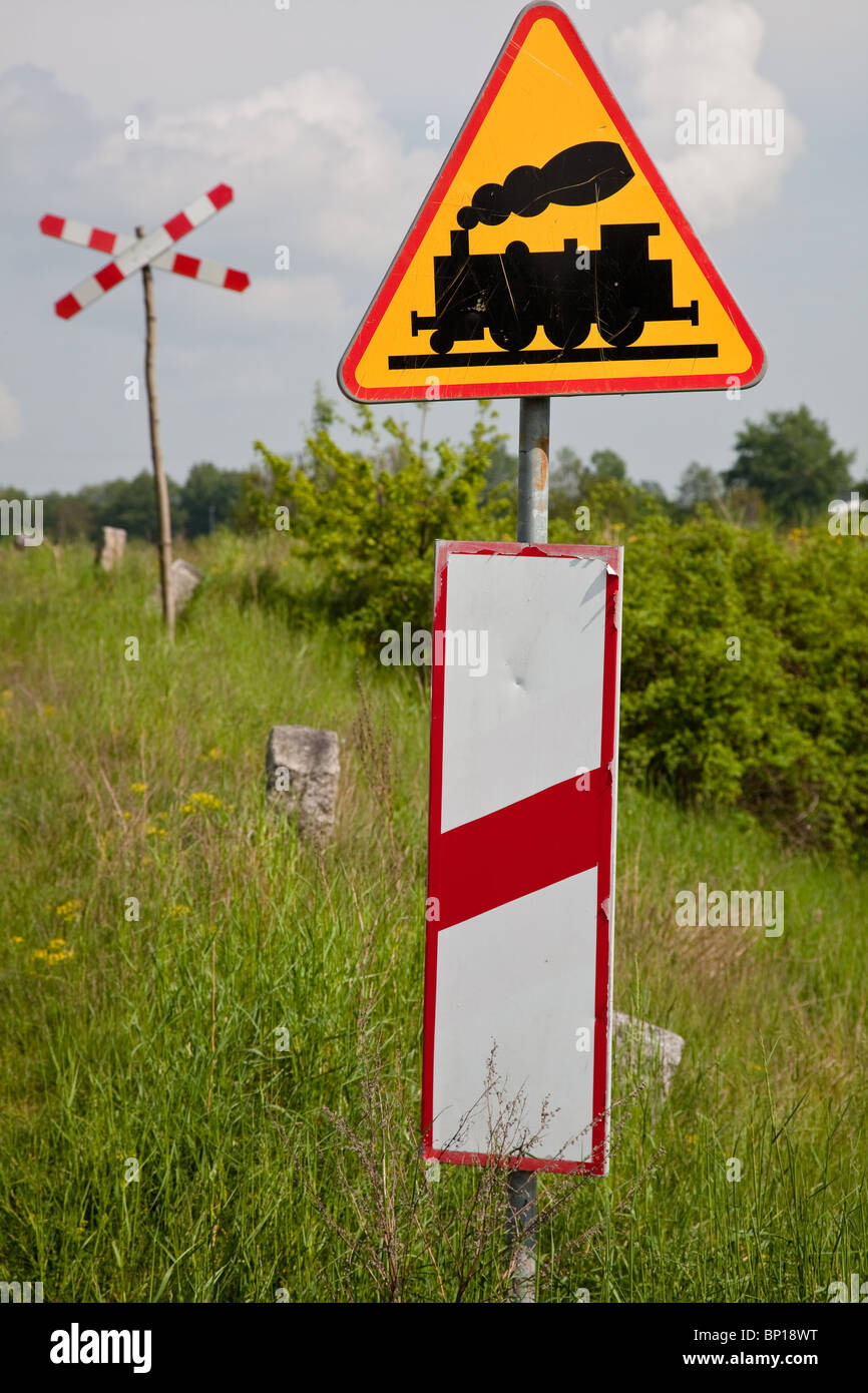 Railroad sing near track in the middle of meadow Stock Photo - Alamy