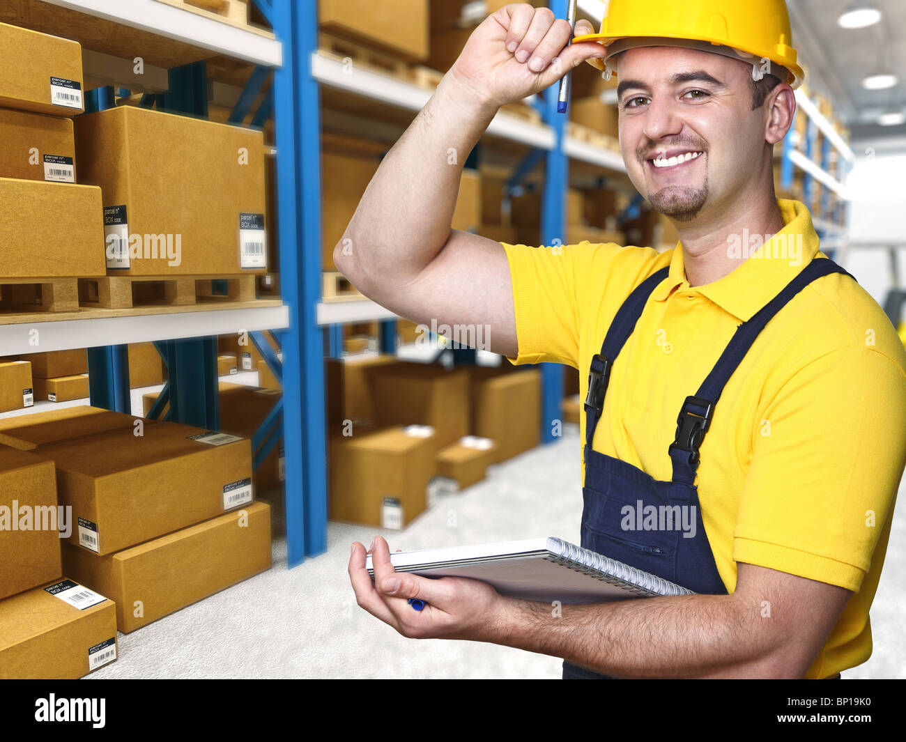 modern manual worker with laptop in warehouse Stock Photo - Alamy