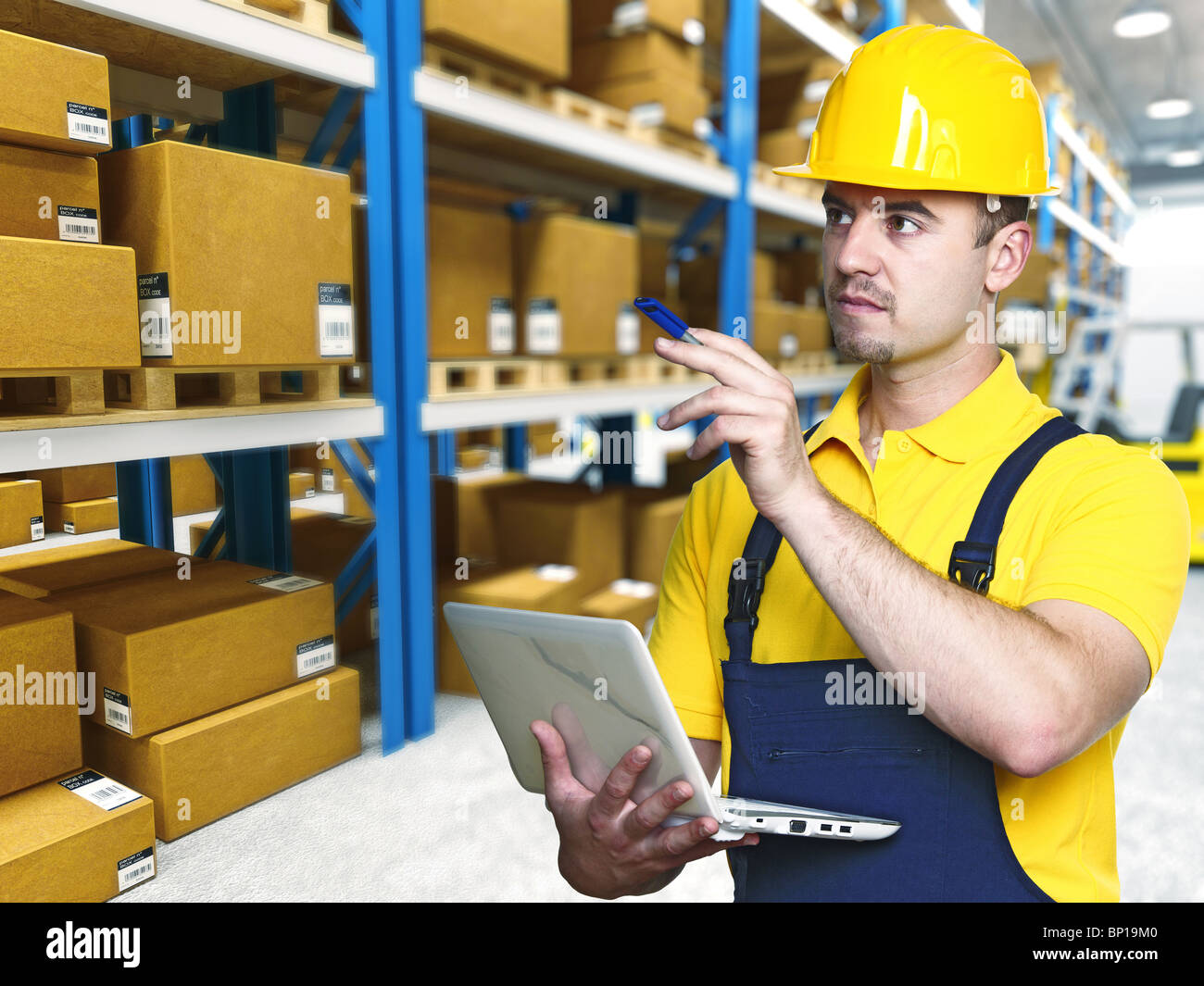 young caucasian manual worker in classic warehouse Stock Photo - Alamy