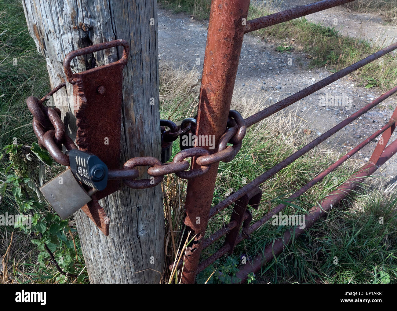 Locked gate on a country footpath in southern counties of England Stock ...