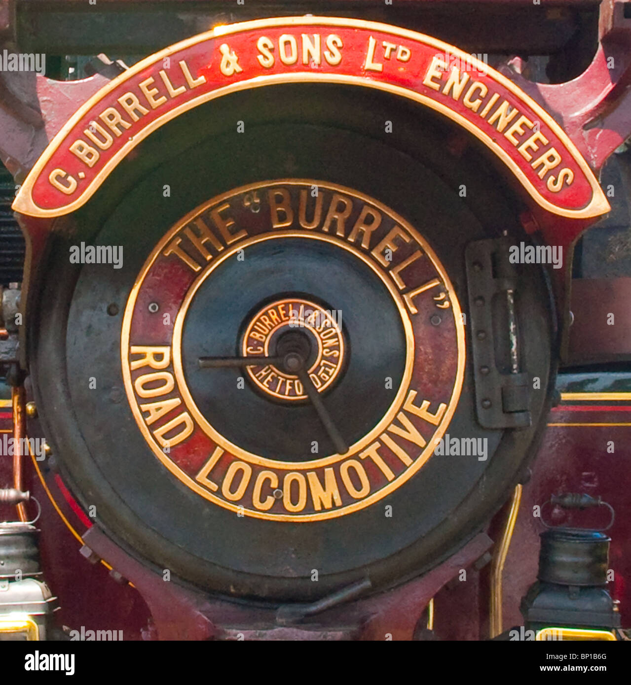 Brass nameplate detailing on the boiler of an antique steam traction ...