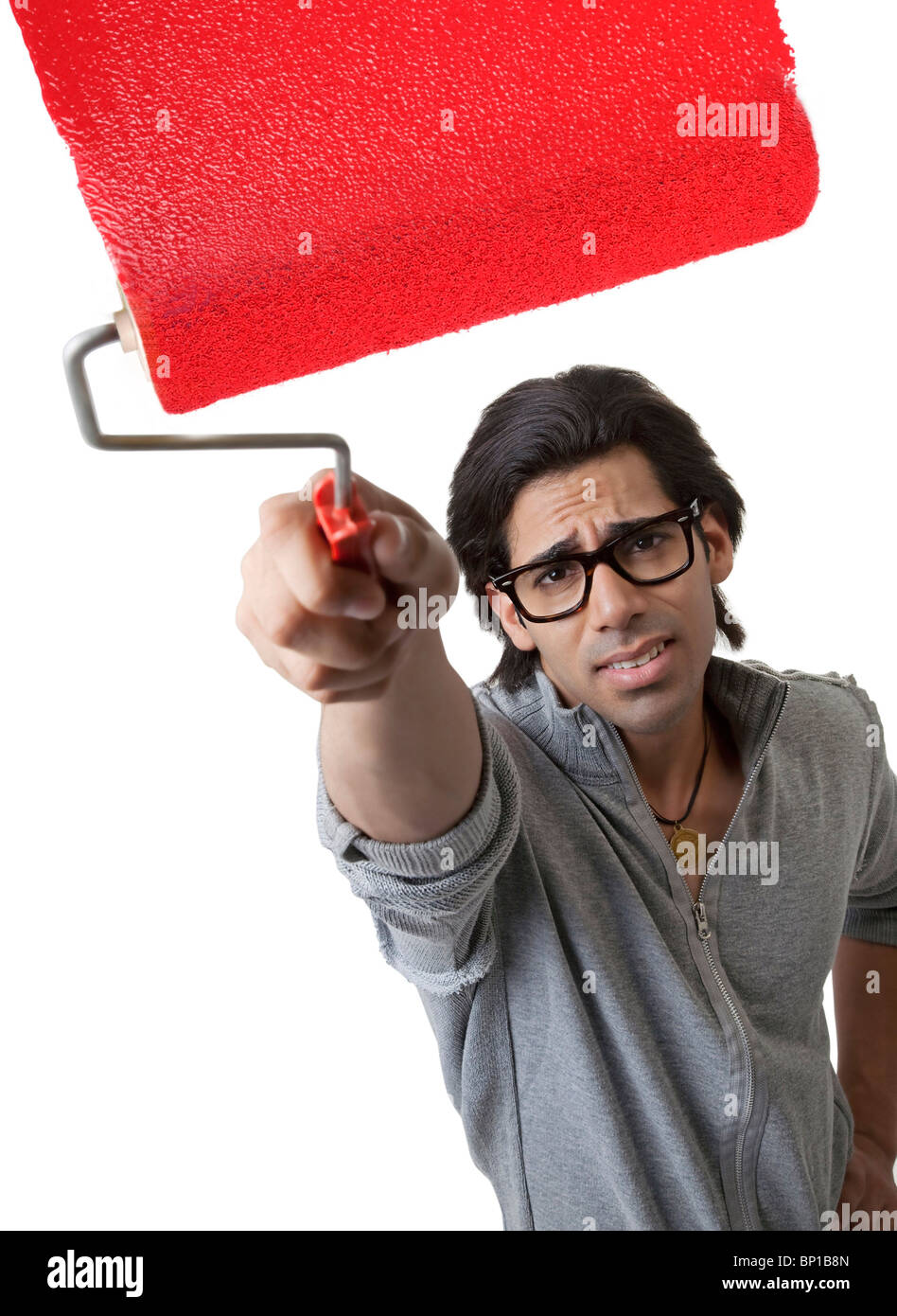 Man holding a paint roller Stock Photo - Alamy