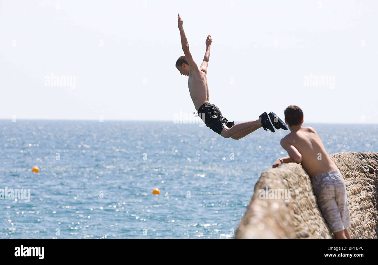 Children jumping into the sea at Brighton. Picture by James Boardman ...