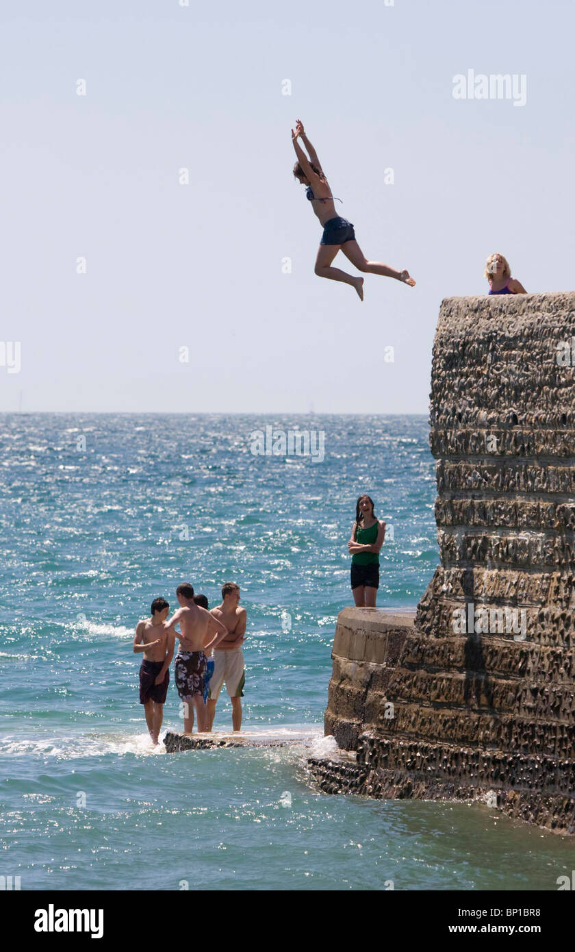 Children jumping into the sea at Brighton. Picture by James Boardman ...