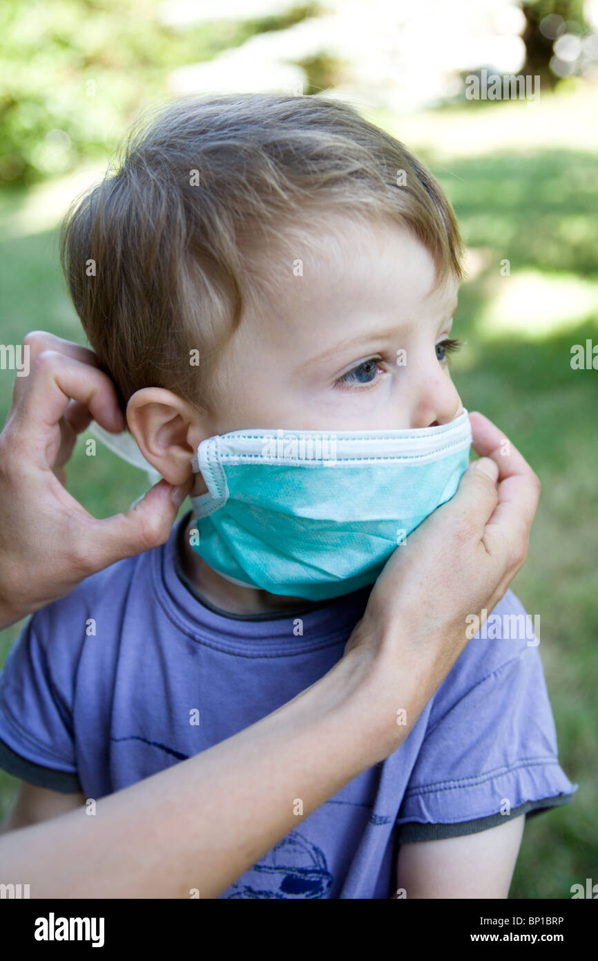 Little boy with protection mask Stock Photo - Alamy