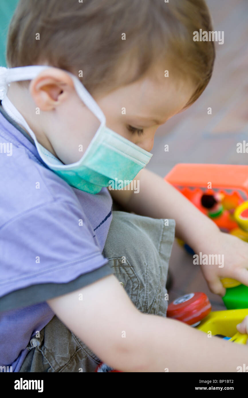 Little boy with protection mask Stock Photo - Alamy