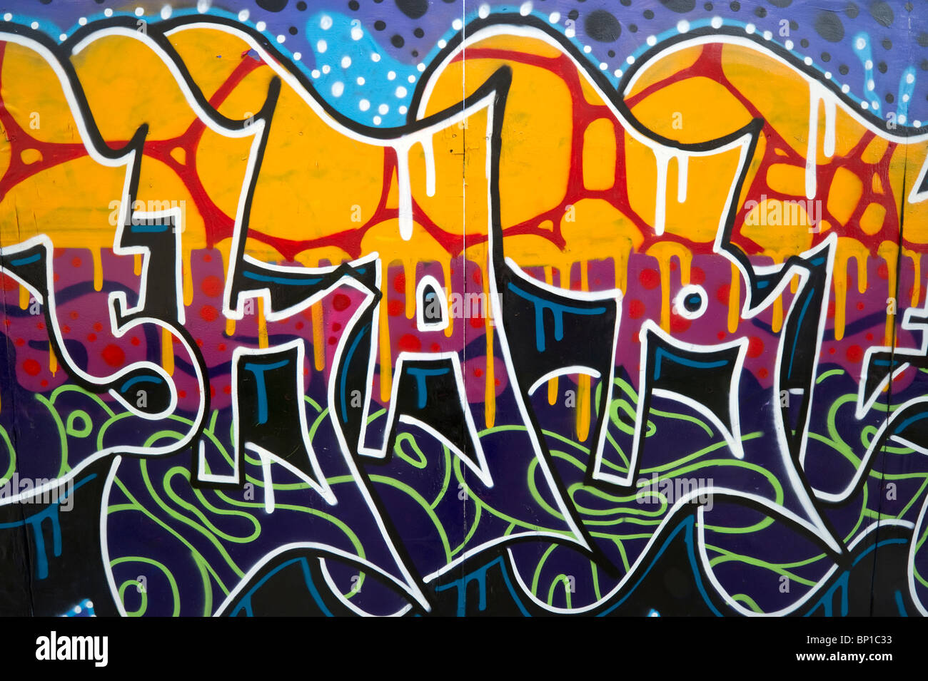 Street art graffiti and spray paint artistry on a derelict concrete ...