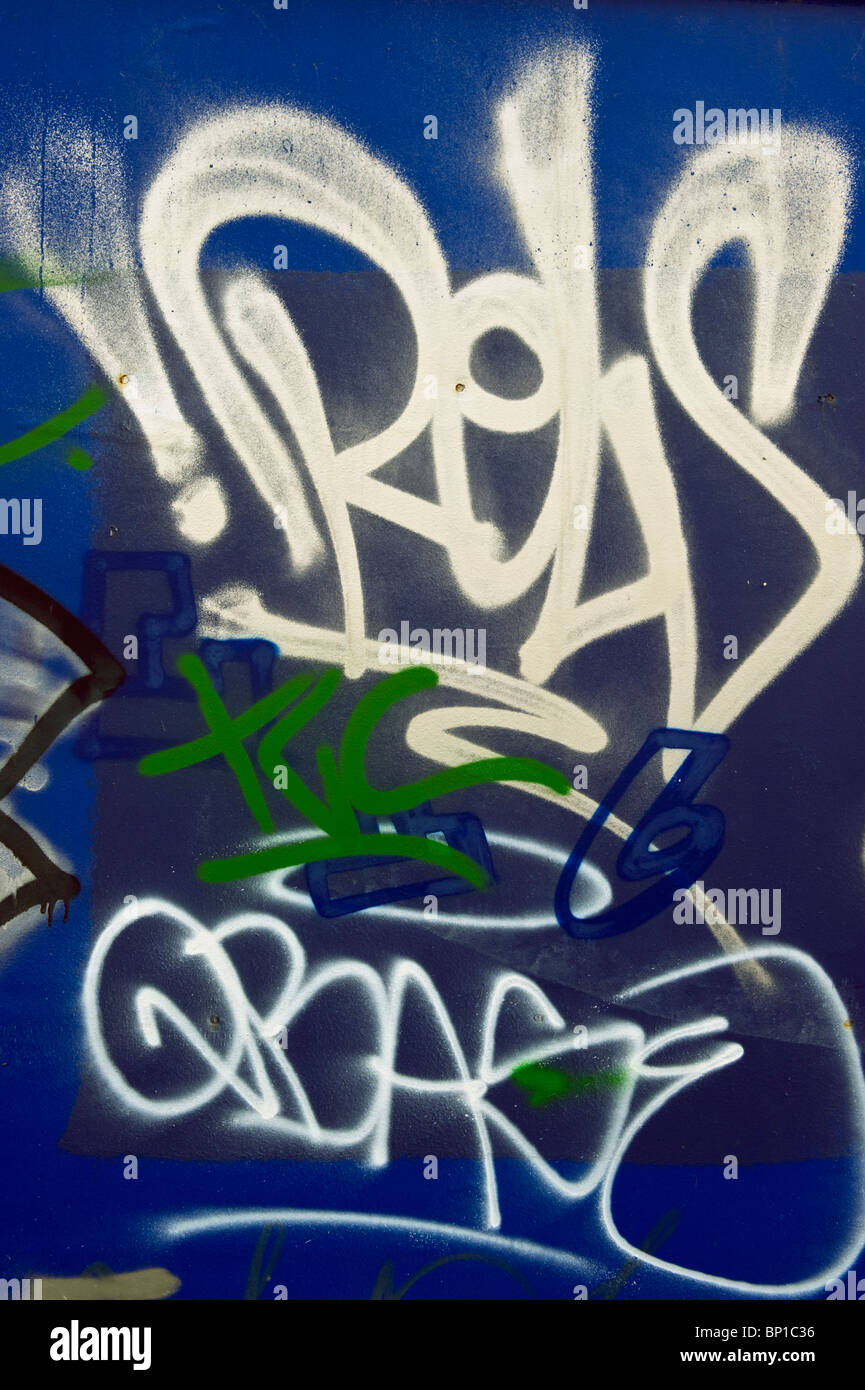Street art graffiti and spray paint artistry on a derelict concrete ...