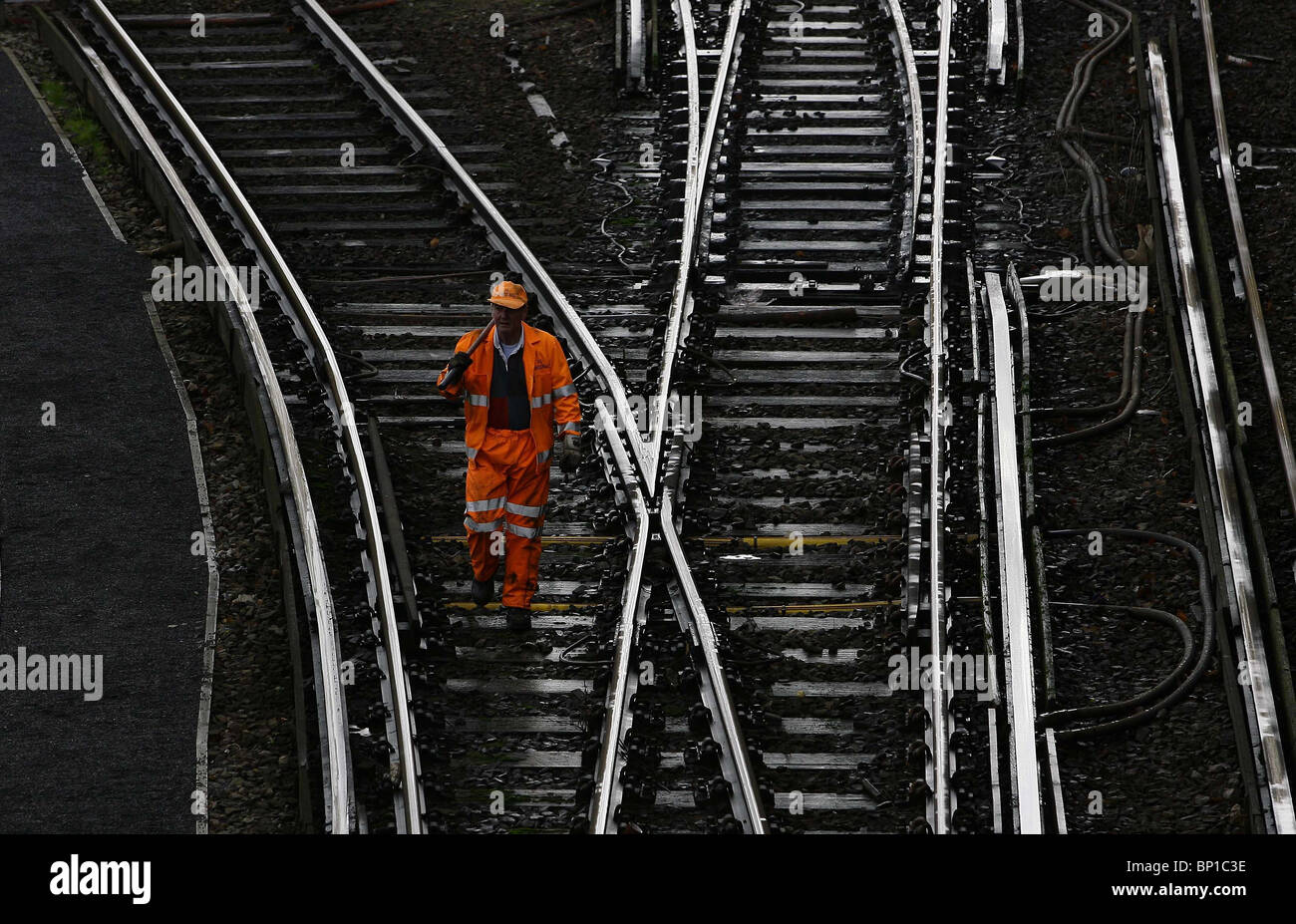 Railway maintenance worker working on the lines at a train depot in ...