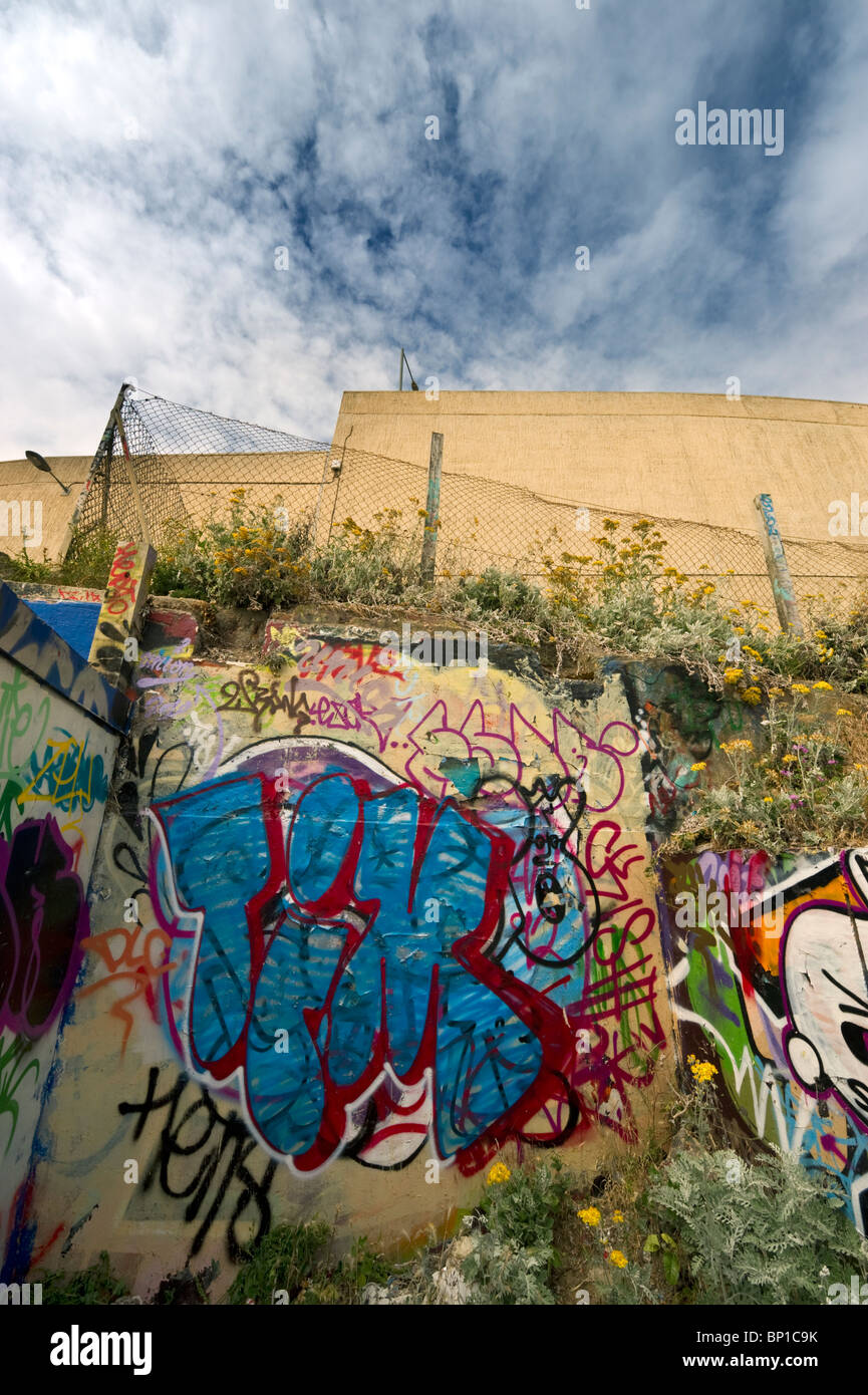 Street art graffiti and spray paint artistry on a derelict concrete ...