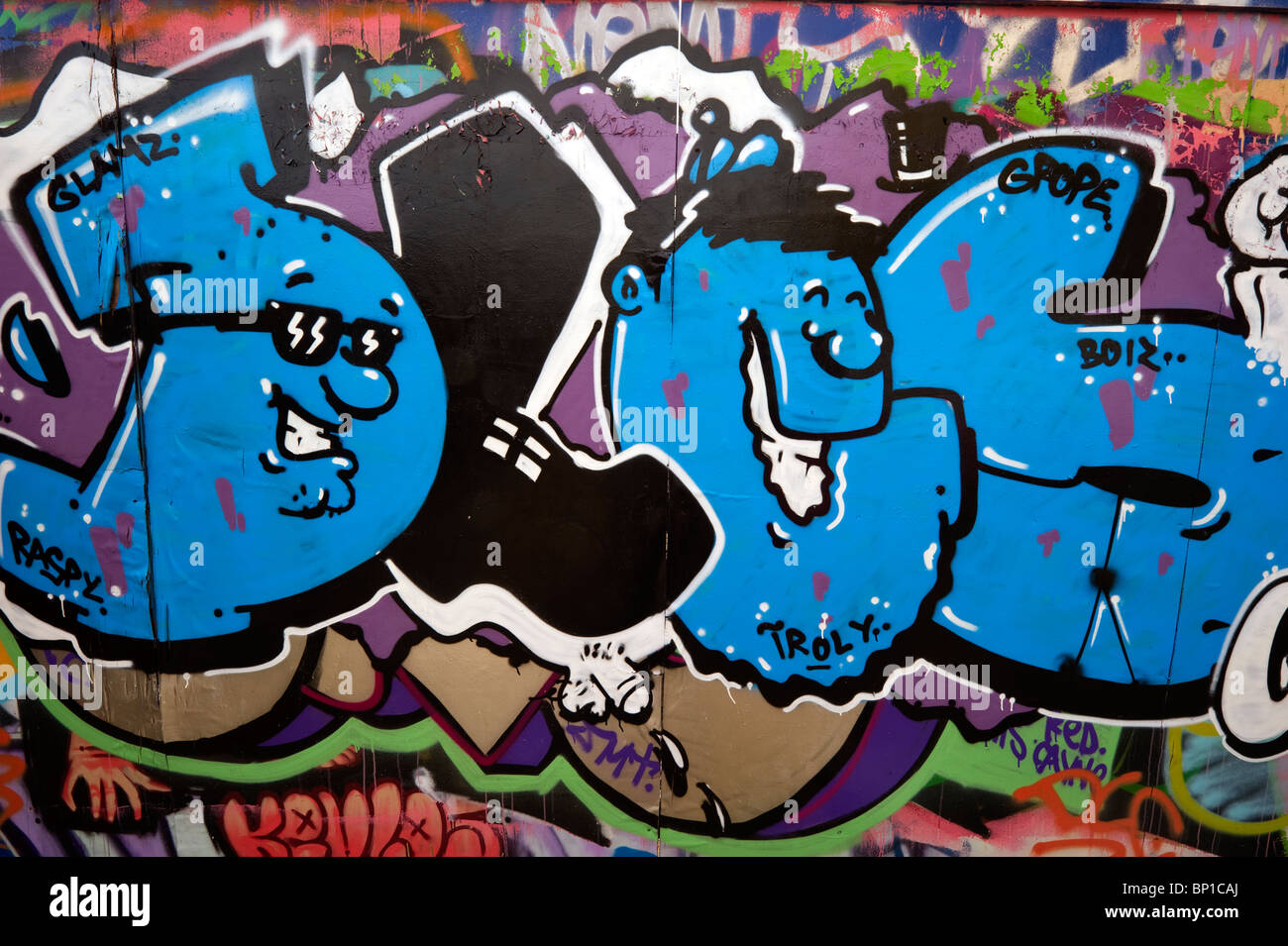 Street art graffiti and spray paint artistry on a derelict concrete ...