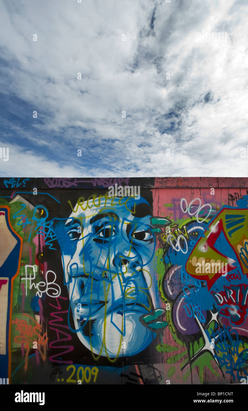 Street art graffiti and spray paint artistry on a derelict concrete ...