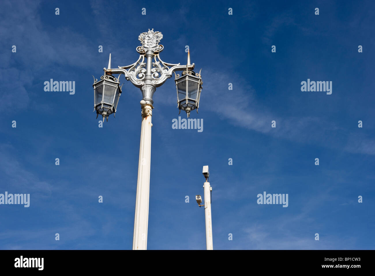 Ornate street lamps; street lights against a summer blue sky along ...