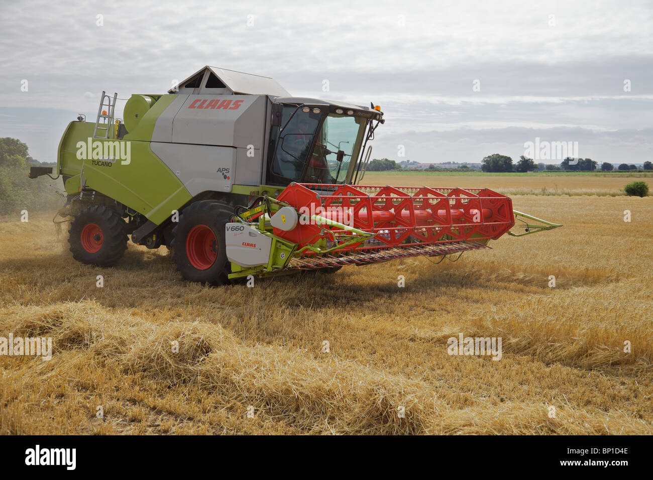 A Claas combine harvester working in England Stock Photo - Alamy