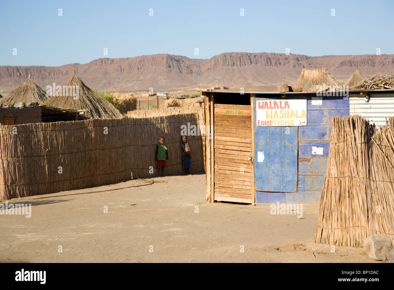 Aussenkehr Village - two boys in shade of reed fence - Southern Namibia ...