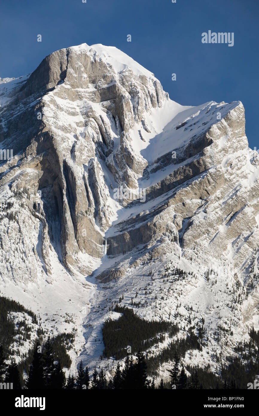 Alberta, Canada; Snow Covered Mountain With Dramatic Fault Lines In ...