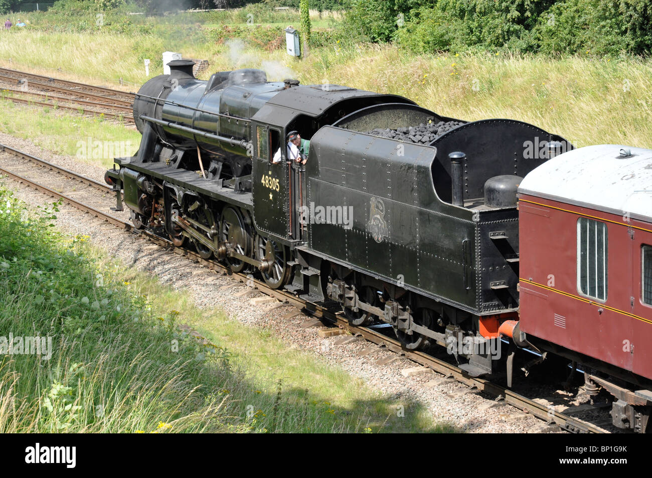Preserved class 8F steam locomotive No. 48305 leaving Quorn on the ...