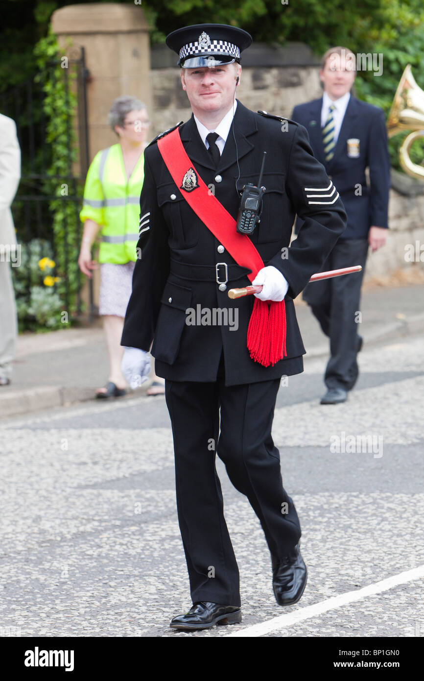 Police Officer leads in parade Stock Photo - Alamy
