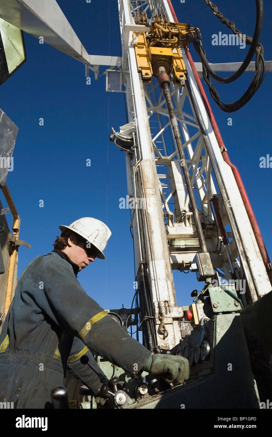 Edson, Alberta, Canada; Drilling Rig Worker Working On The Control ...
