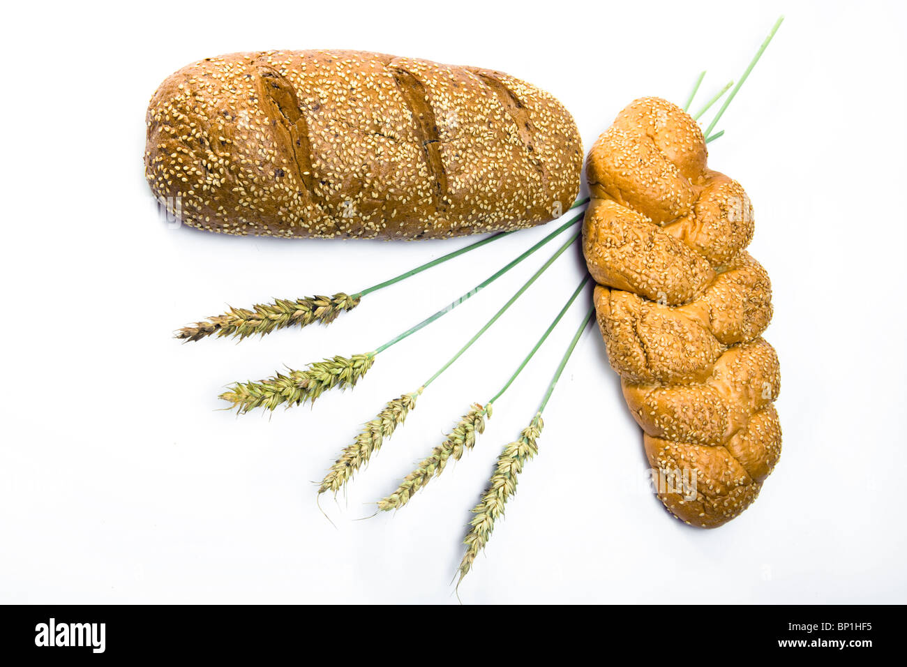 Wheat and bread on white background Stock Photo - Alamy