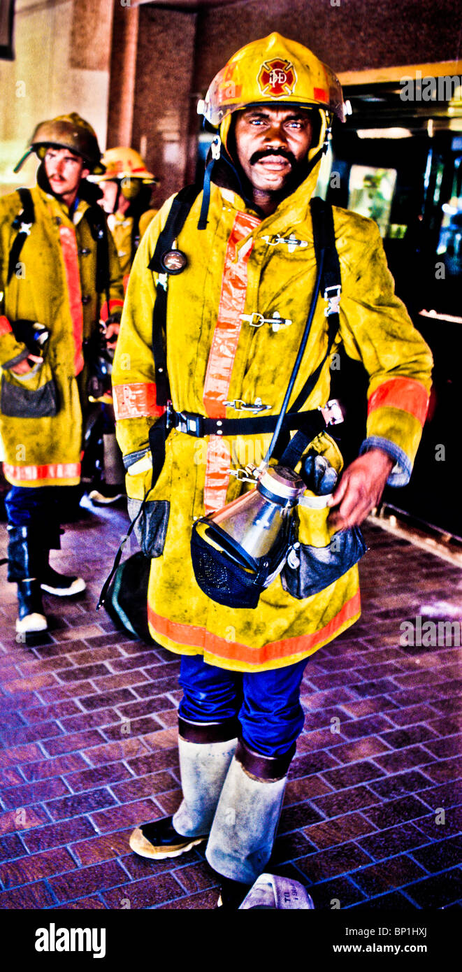Firemen await instructions Stock Photo - Alamy