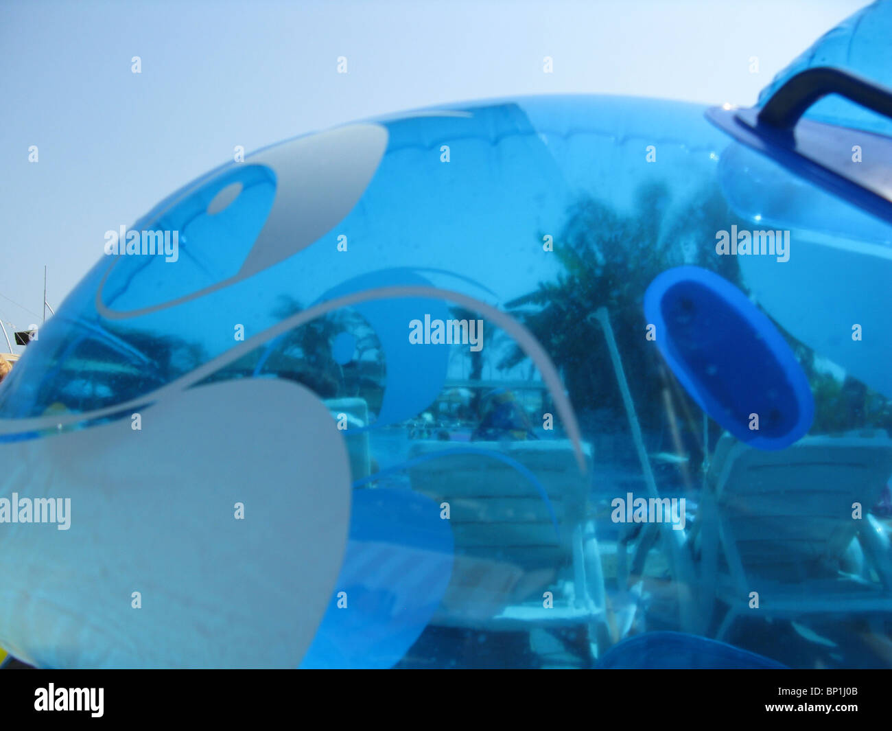 view of swimming pool through large blue inflatable Stock Photo - Alamy