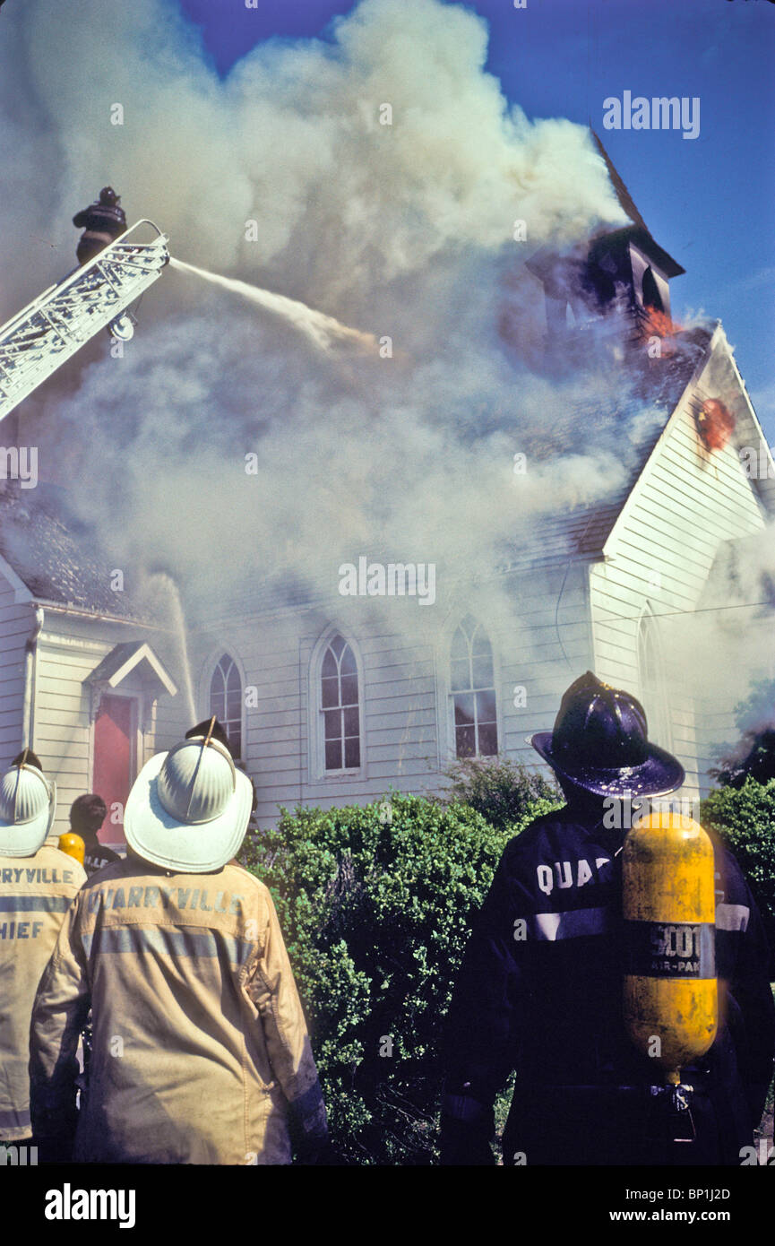 Volunteers fight church fire blaze Stock Photo - Alamy