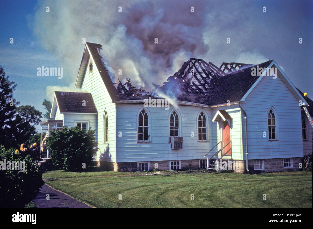 Volunteers fight church fire blaze Stock Photo - Alamy