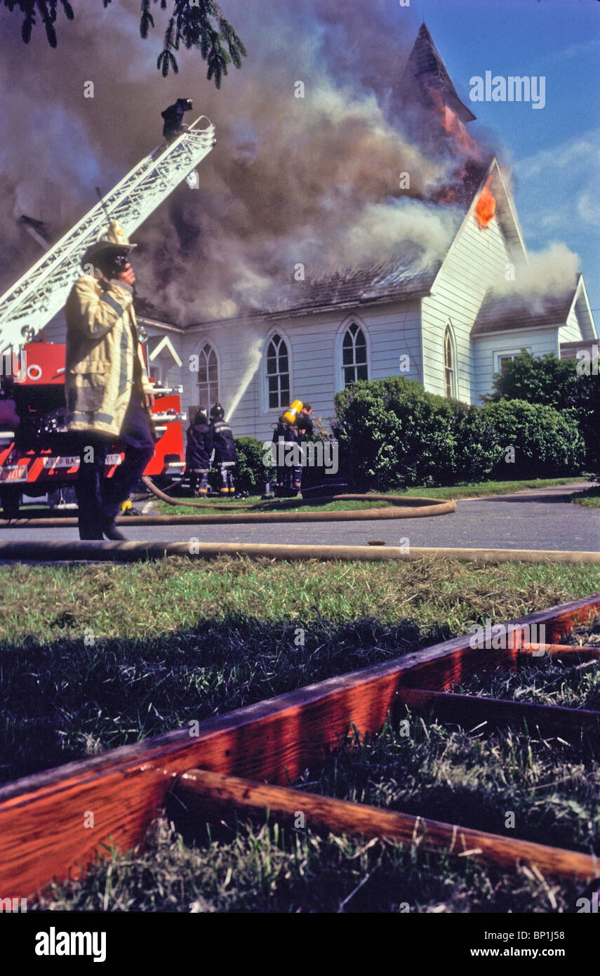 Volunteers fight church fire blaze Stock Photo - Alamy