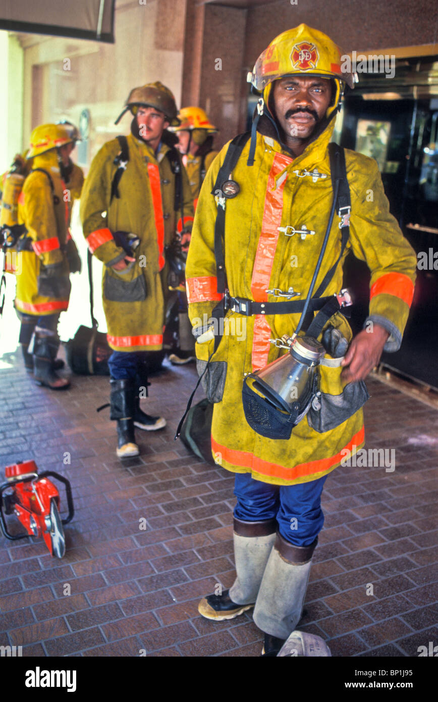 Firemen await instructions Stock Photo - Alamy