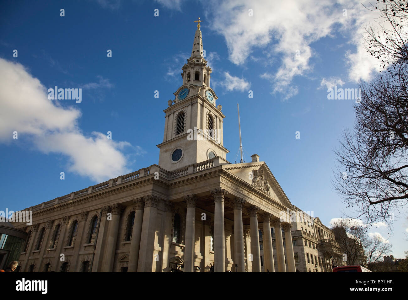 A Building With Columns, A Clock Tower And A Spire Stock Photo - Alamy
