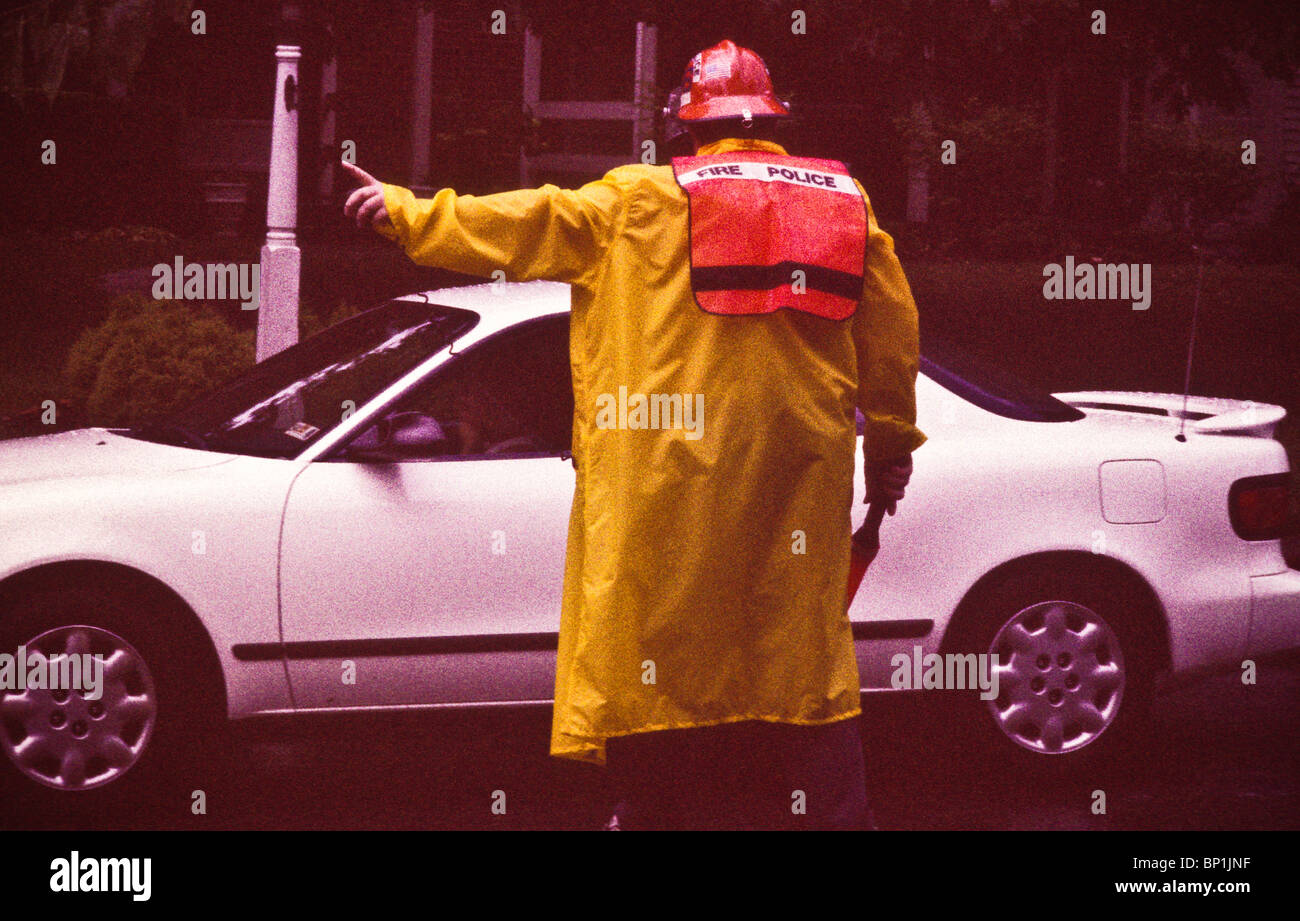 Fire police directs traffic at scene Stock Photo - Alamy