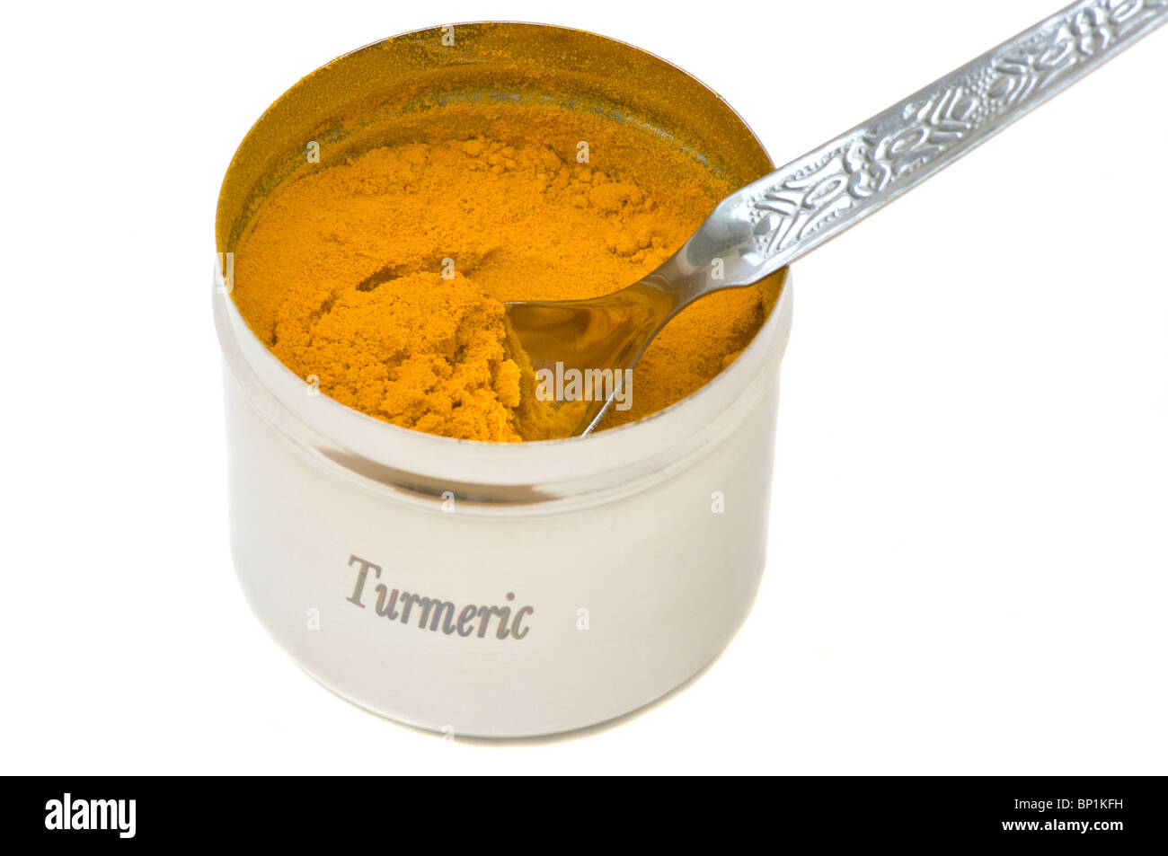 A Chrome Pot Of Turmeric With A Spoon Stock Photo - Alamy