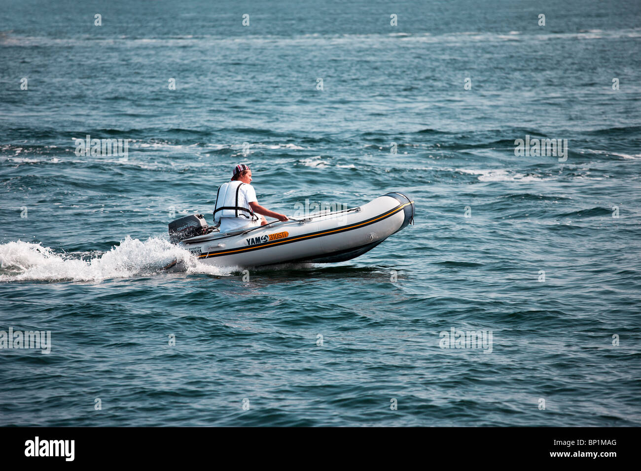 Boy driving boat hi-res stock photography and images - Alamy
