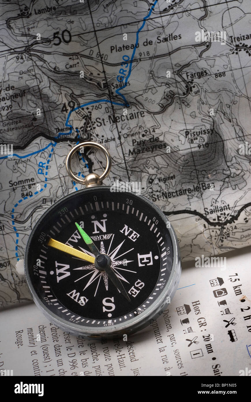 Compass and trekking map Stock Photo - Alamy