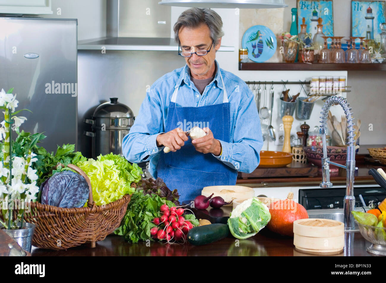 Man cooking in kitchen Stock Photo - Alamy